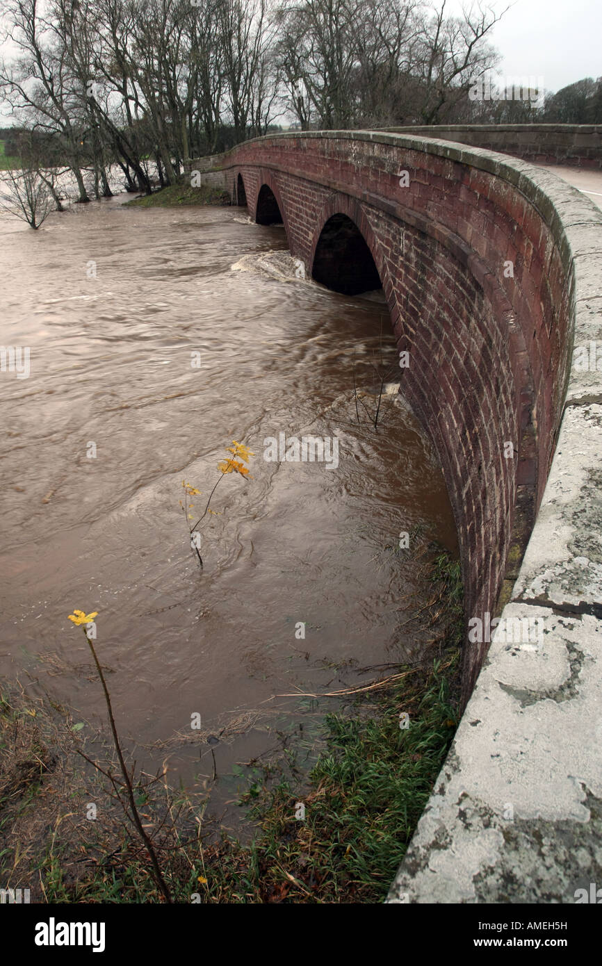 Flood waters of the River Deveron rise beneath a road bridge on the ...