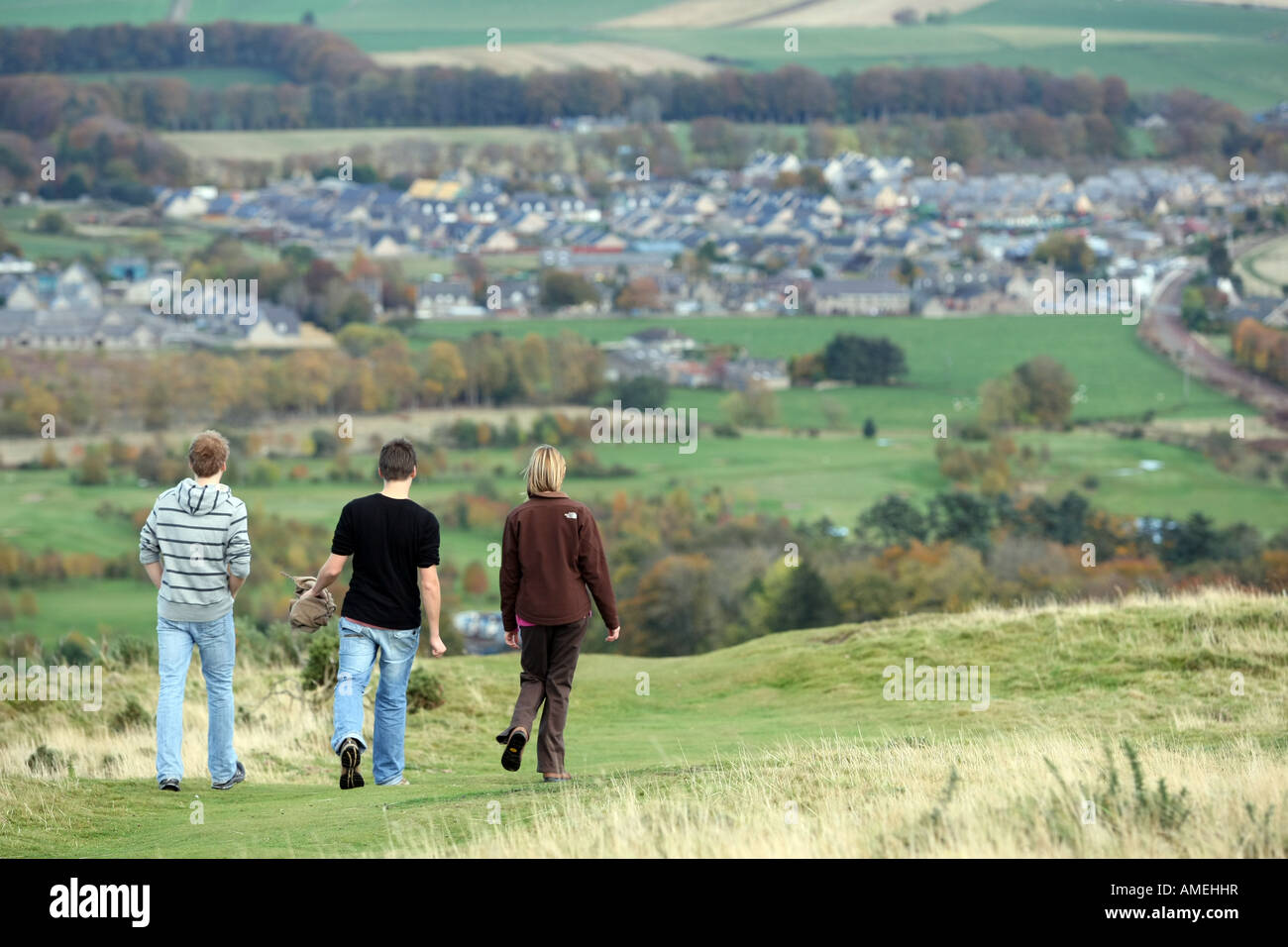 People walking on the hill overlooking the town of Insch in ...