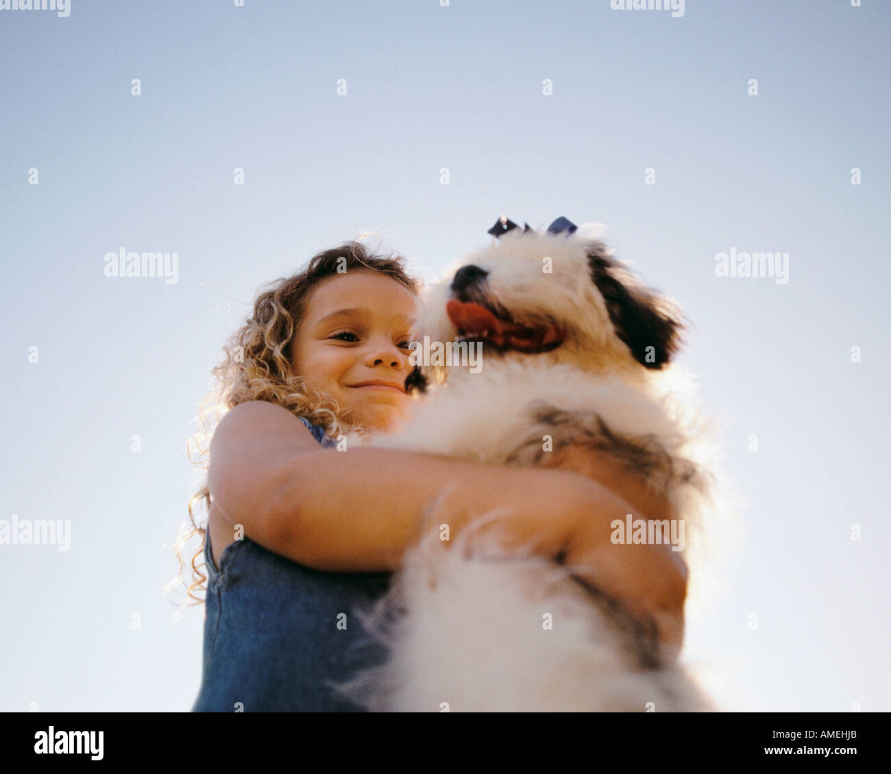 Girl Hugging Dog Outdoors Stock Photo - Alamy
