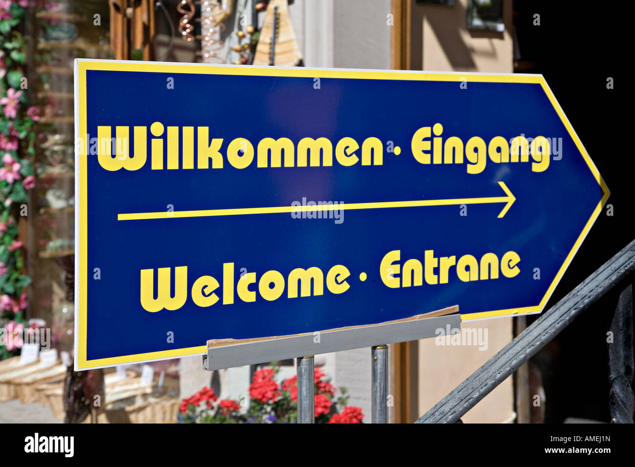 Welcome sign in four languages outside tourist shop Rothenburg Germany ...
