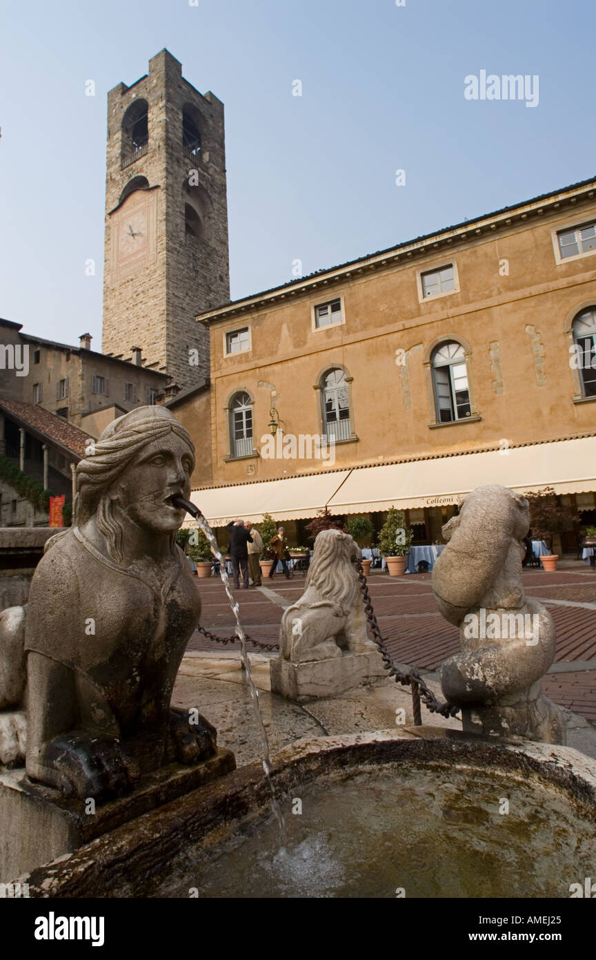 Tower of Bergamo Alta old city with fountain drinking water in old ...