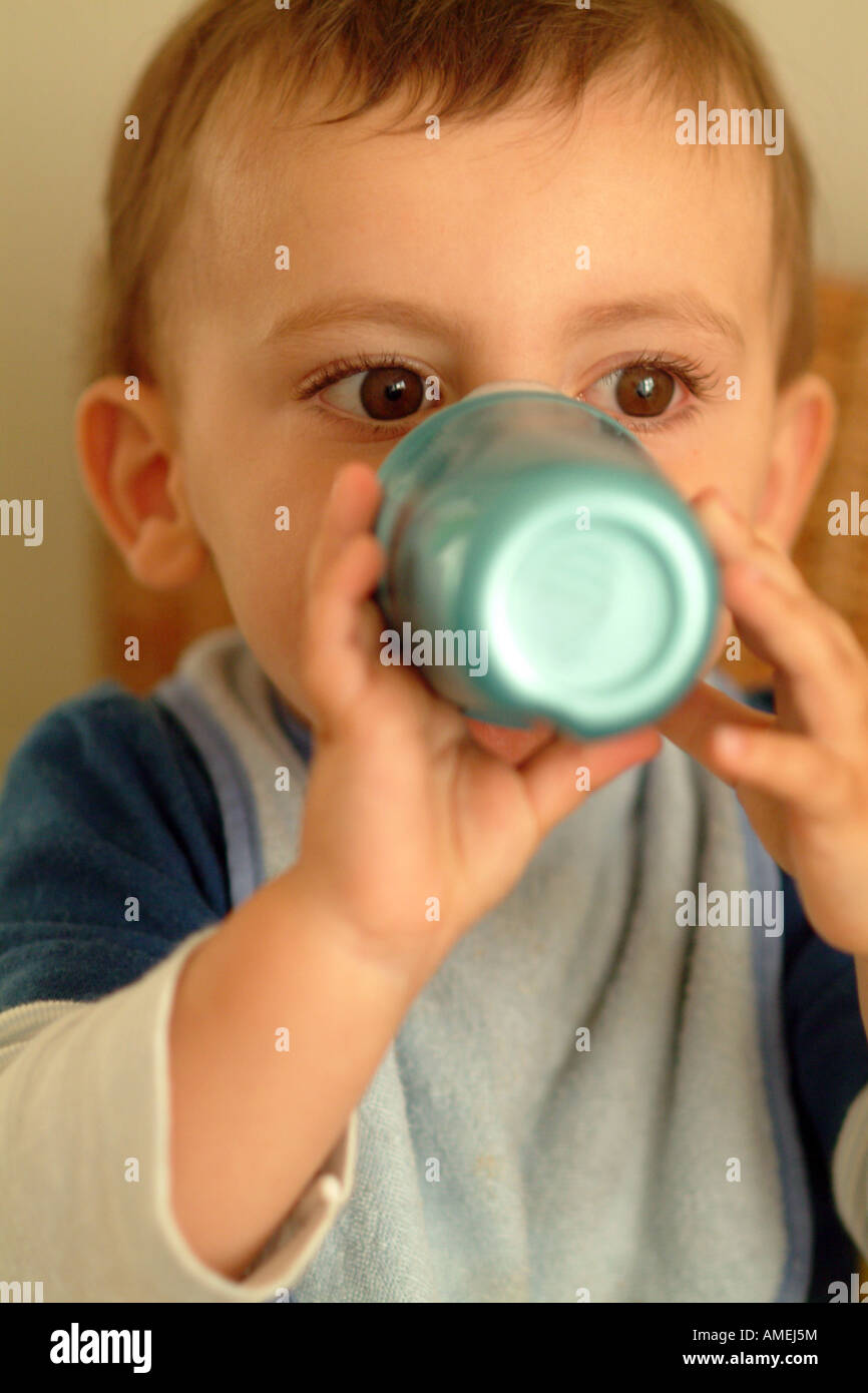 Happy baby drinking from a cup Stock Photo - Alamy