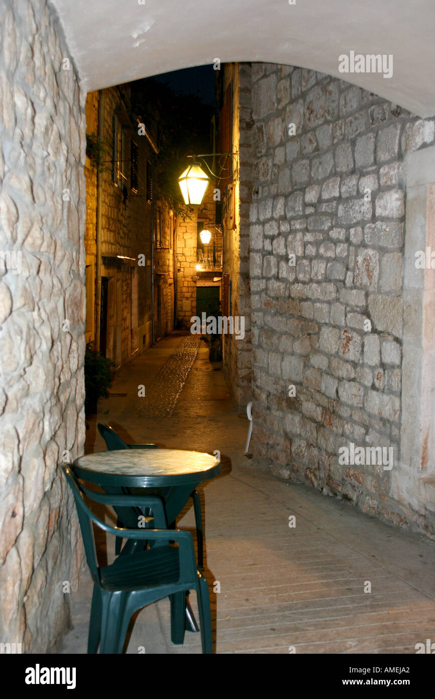 A narrow street in Stari Grad town at night on Hvar Island Stock Photo ...