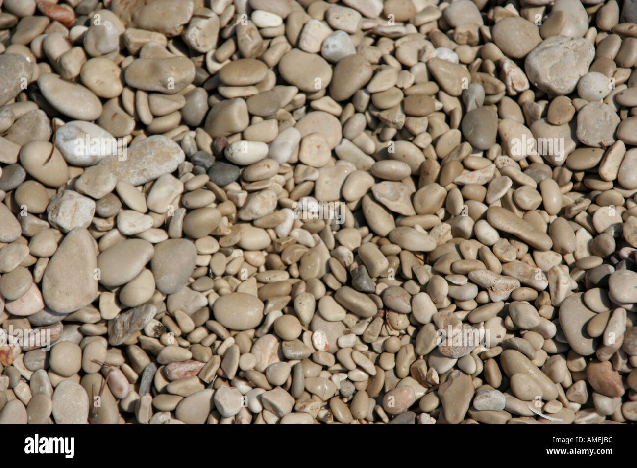 Pebbles lying on a beach Stock Photo - Alamy