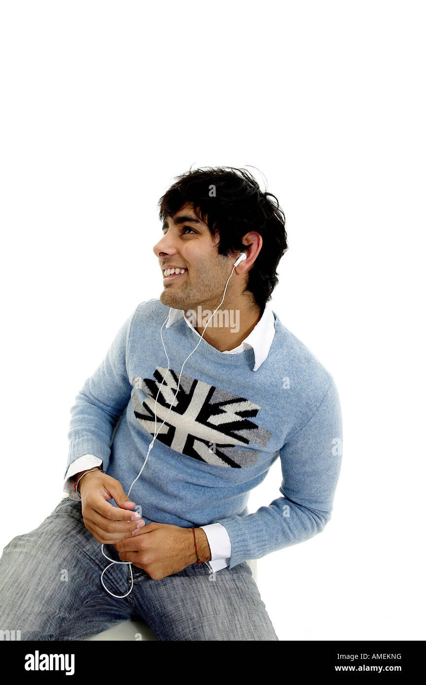 Young Man Listening to mp3 Player Stock Photo - Alamy
