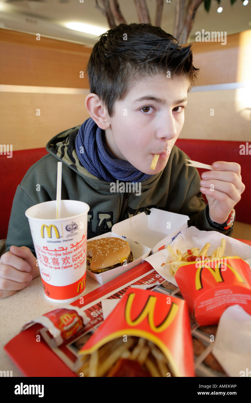 teenager eating at a fast food restaurant Stock Photo, Royalty Free ...
