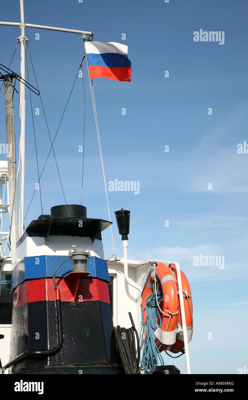 Russian flag over the small ship Stock Photo - Alamy