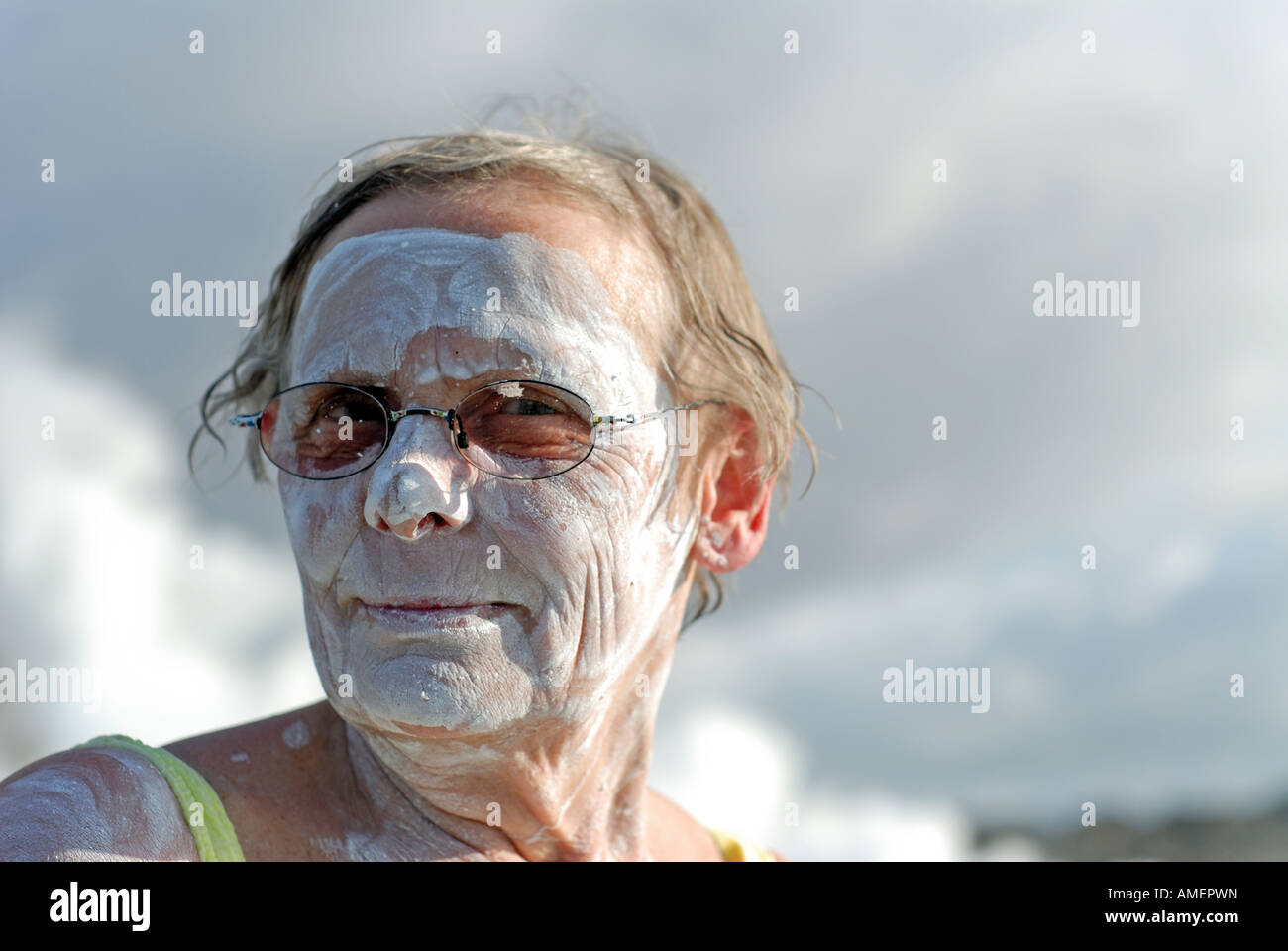 Elderly woman with skin healing mud on her face Blue Lagoon Iceland ...