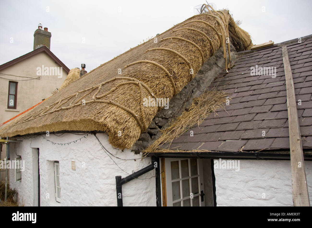 small cottage thatched roof renovation in traditional welsh style ...
