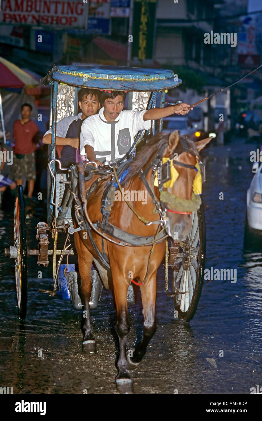 Kalesa at night, Manila, Philippines Stock Photo - Alamy
