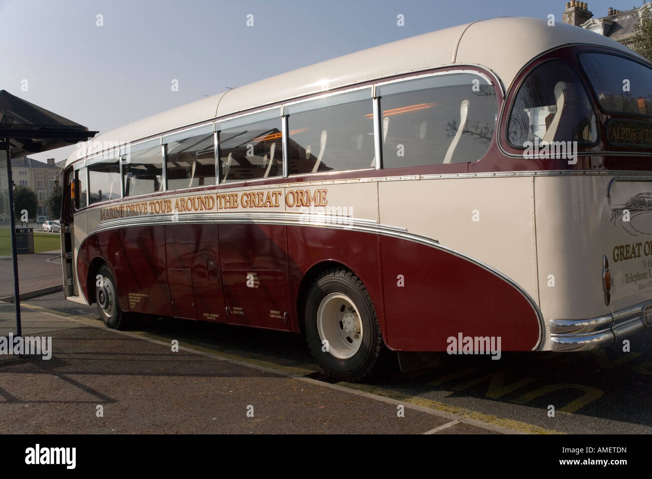 Old classic bus on Llandudno promenade used as Great Orme Tour, North ...