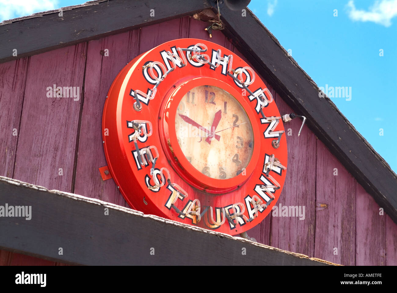 Longhorn Restaurant old fashioned time worn clock on the outside of the ...
