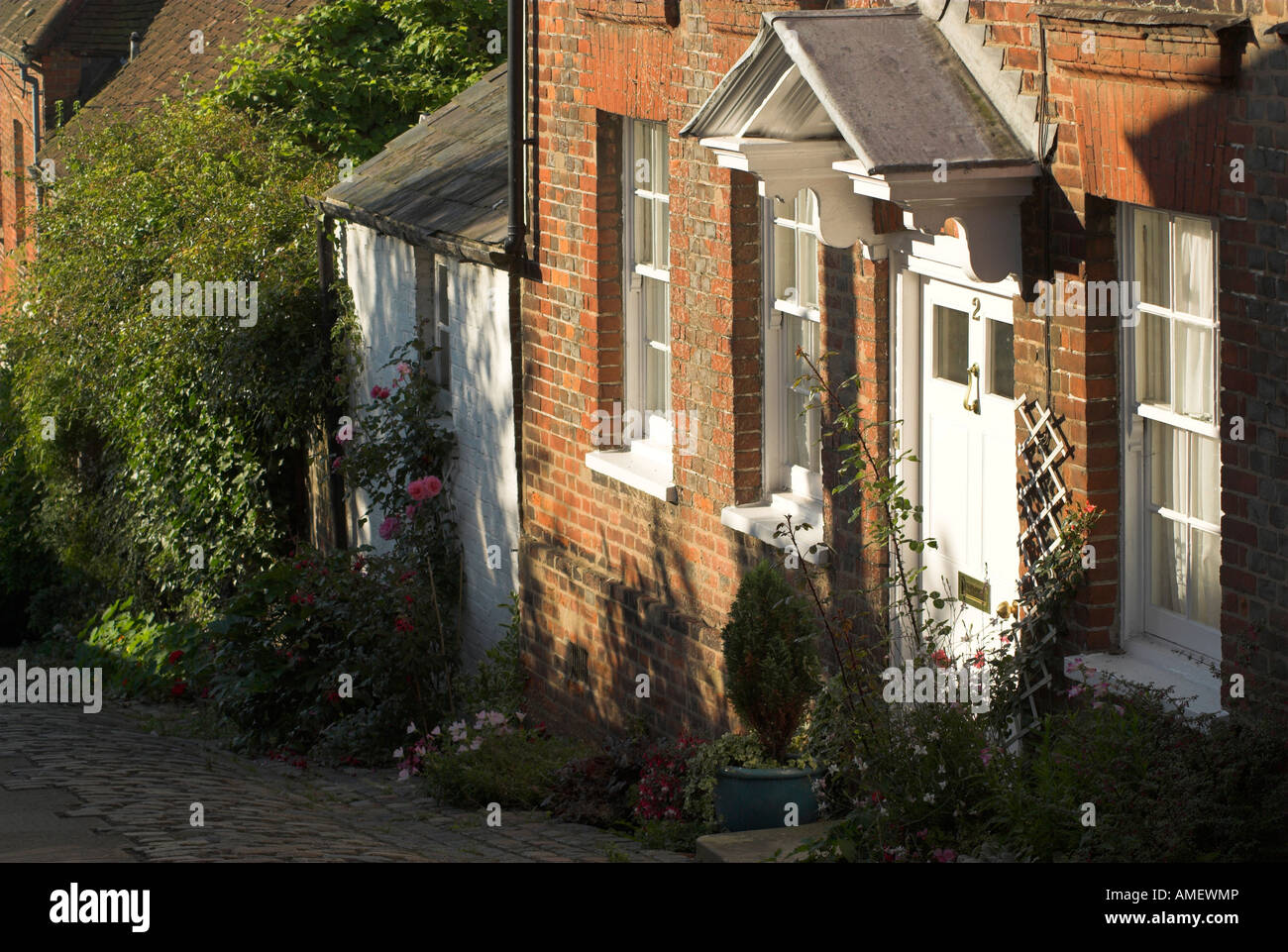 Early morning sun pitches onto a cottage in Arundel, West Sussex Stock ...