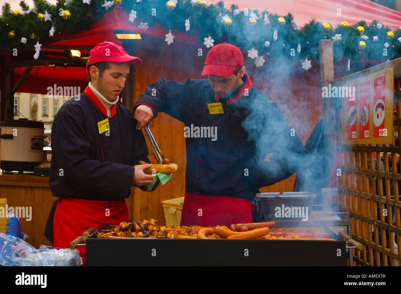 Grilling meat at Christmas market on Old Town Square, Prague Czech ...