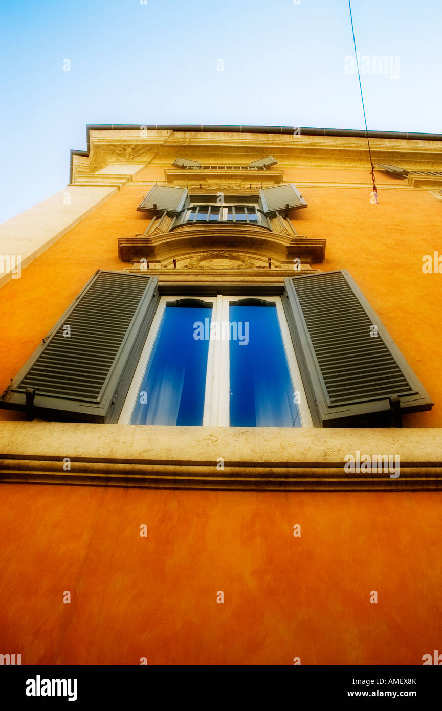 Warm coloured building against a blue sky Rome Stock Photo - Alamy