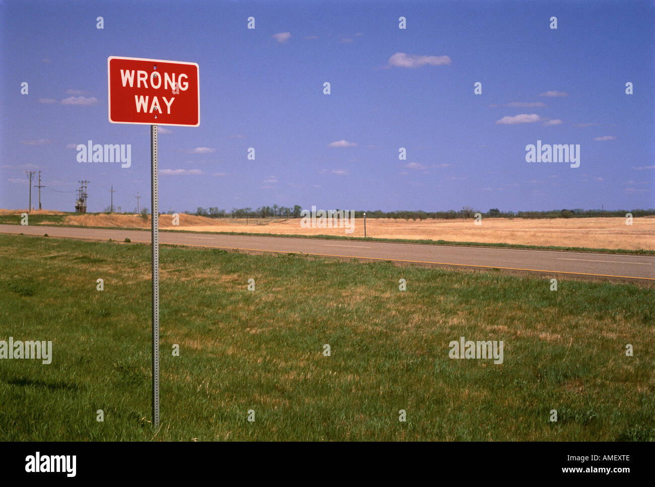 Wrong Way Sign near Road Stock Photo - Alamy