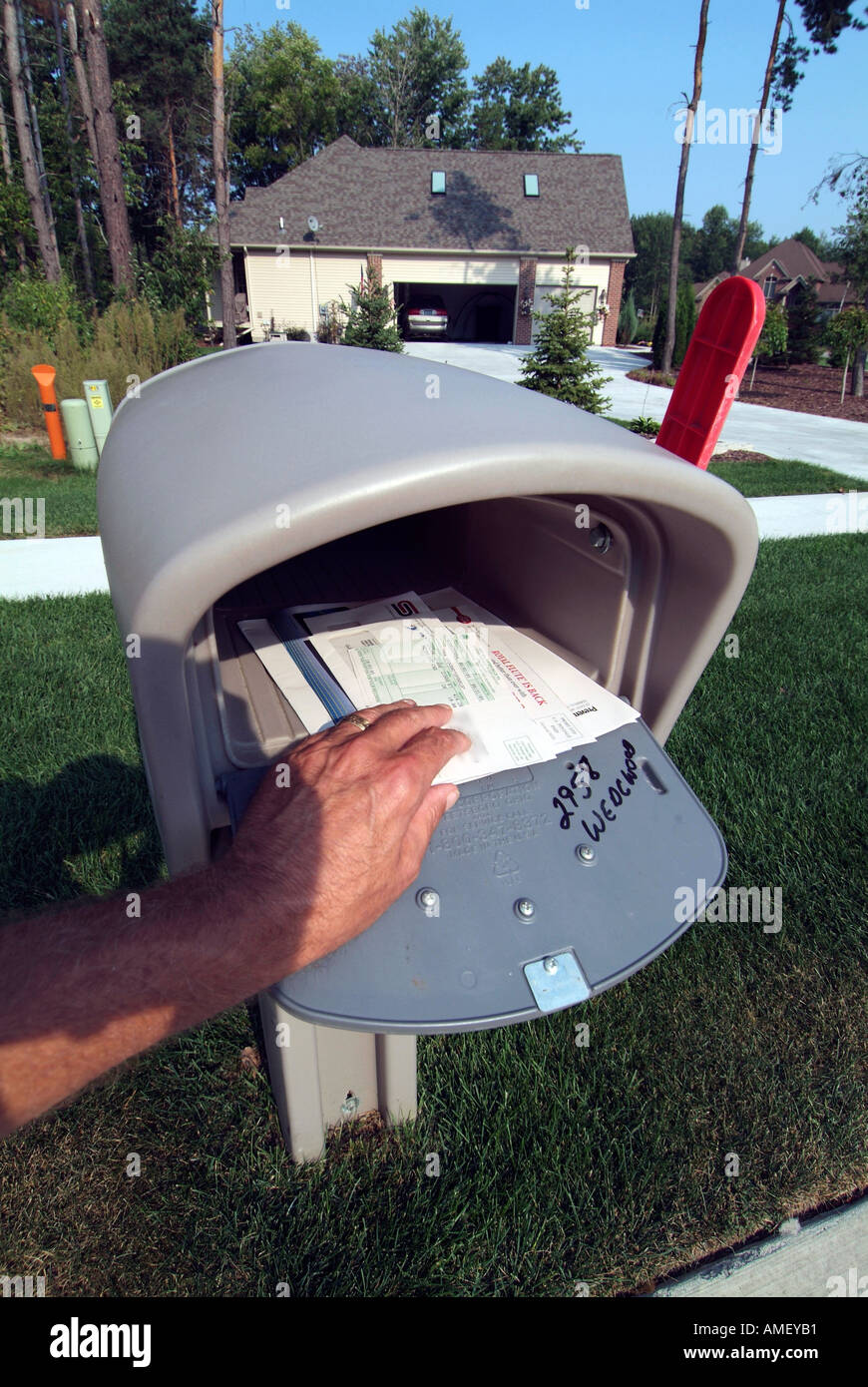 Mailbox with letters bills statements of communication Stock Photo - Alamy
