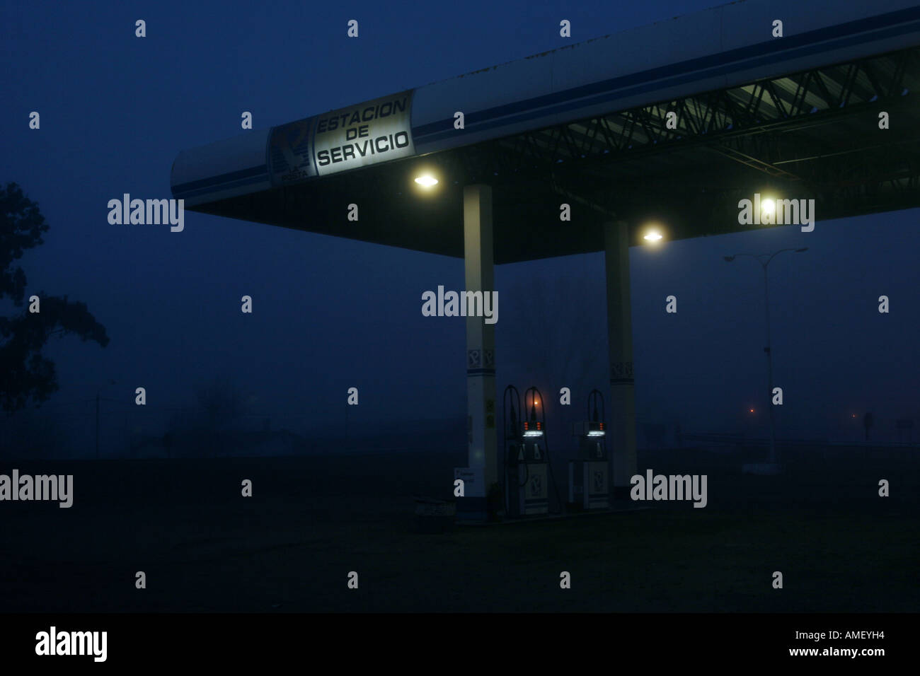 Empty and isolated gas station in the middle of a lonely road A misty ...