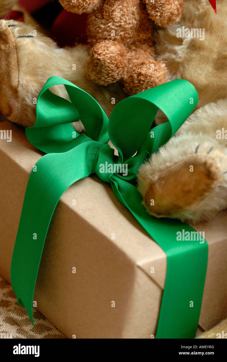 wrapped gift and teddy bear feet Stock Photo - Alamy