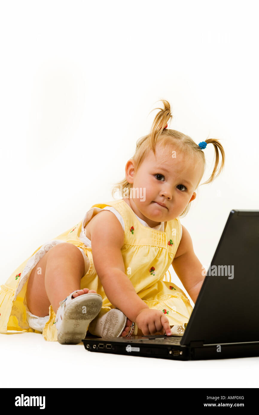Baby and laptop computer Stock Photo - Alamy