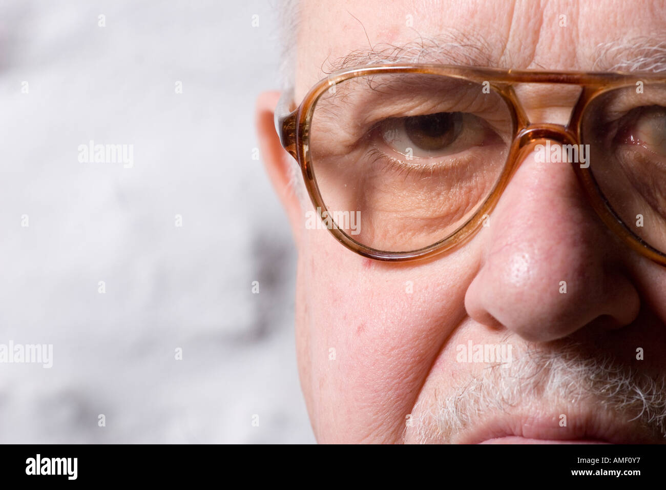 Close up of the face of a serious tough old man Stock Photo - Alamy