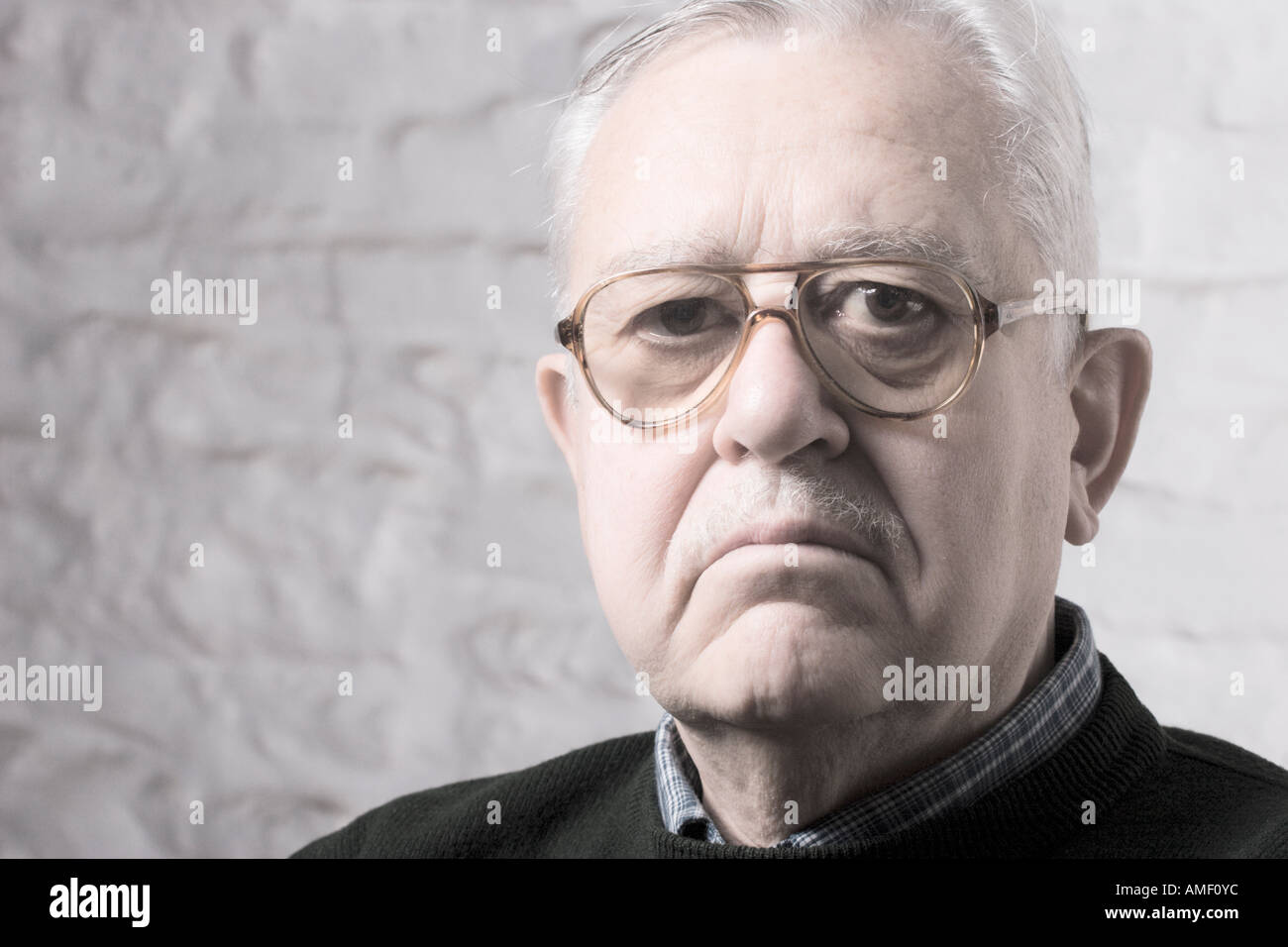 Face of a serious tough old man (desaturated Stock Photo - Alamy