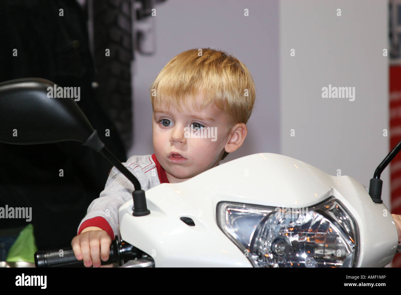 Small boy on motor cycle Stock Photo - Alamy