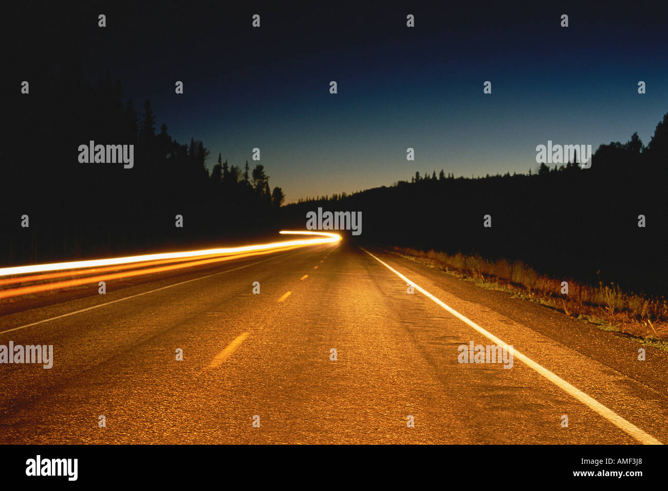 Light Trails on Road at Night Stock Photo - Alamy