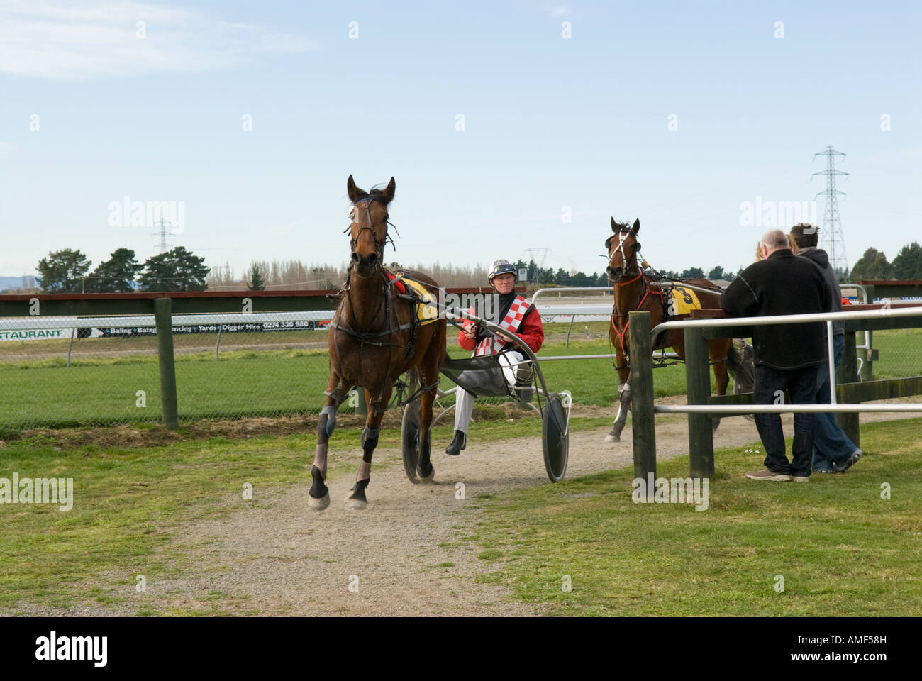 A harness racing rider returns to the paddocks after a race at Rangiora ...