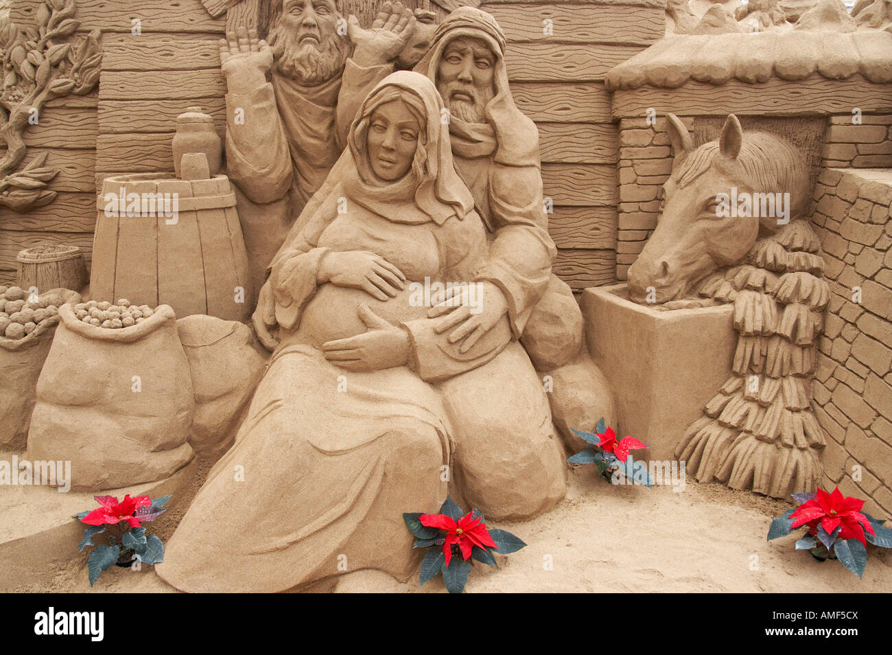 Sand sculptured nativity scene showing Mary and Joseph asking for ...