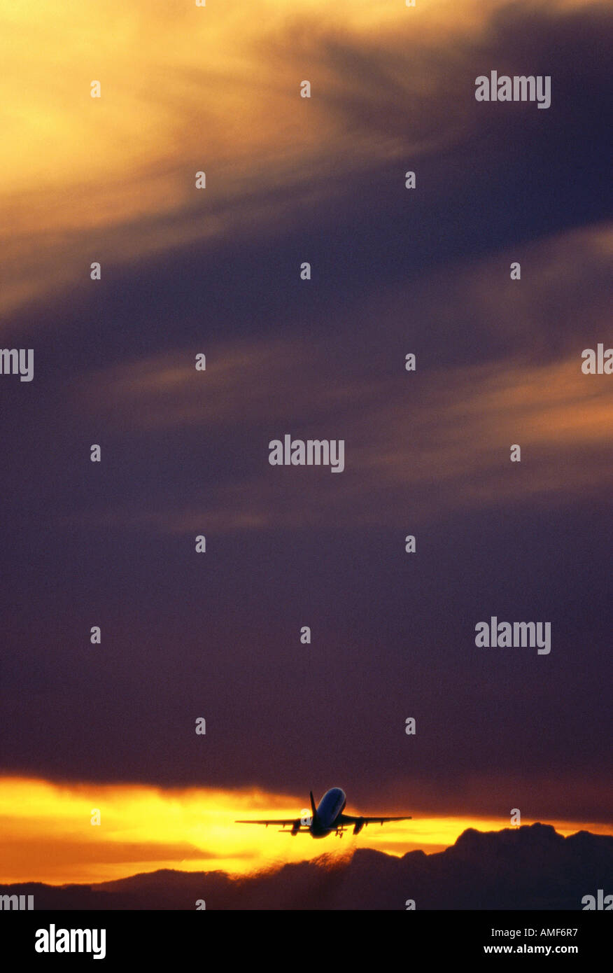 Airplane Taking Off at Sunset Stock Photo - Alamy