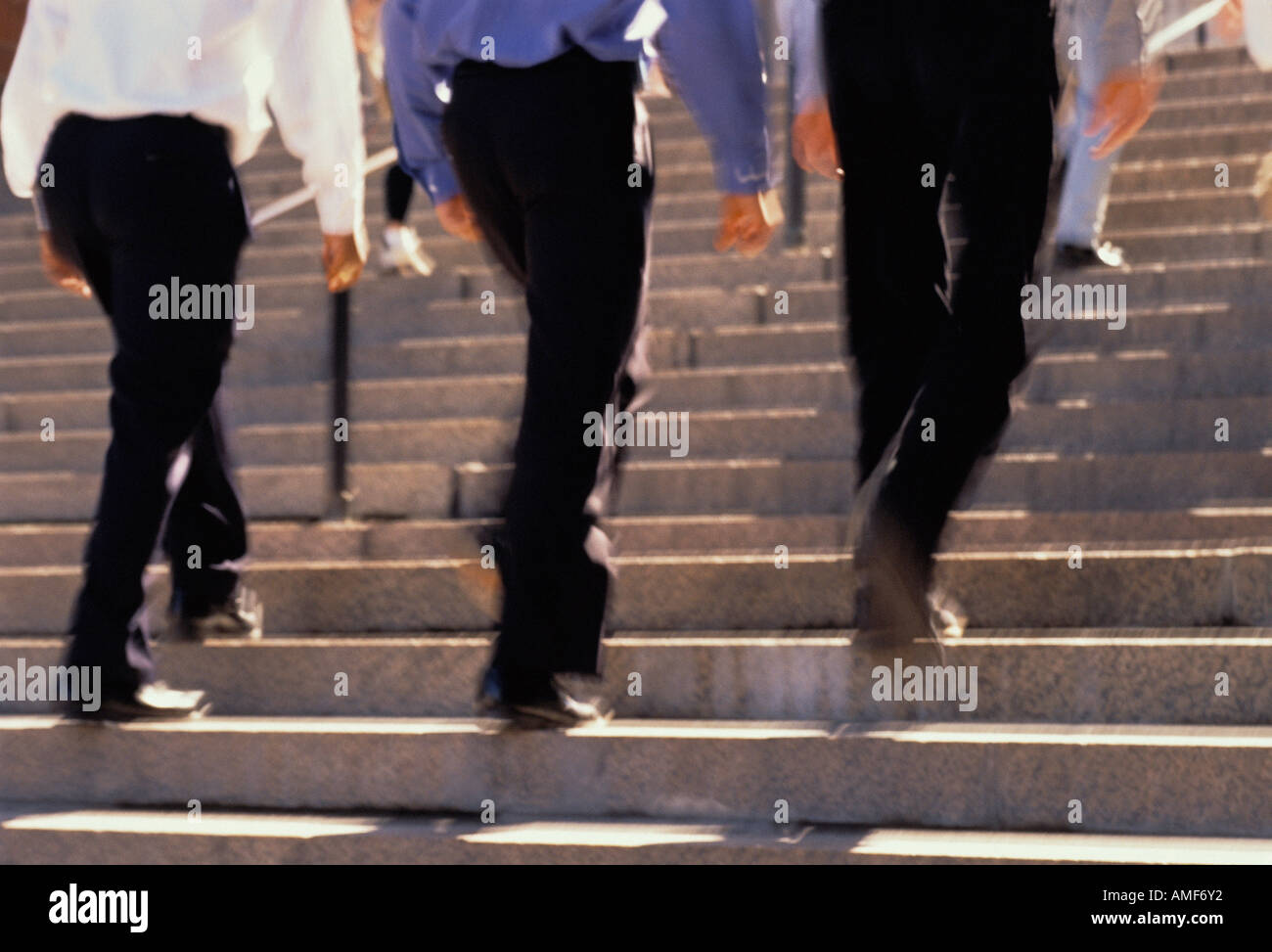 Back View of Businessmen Walking Up Steps Outdoors Stock Photo - Alamy