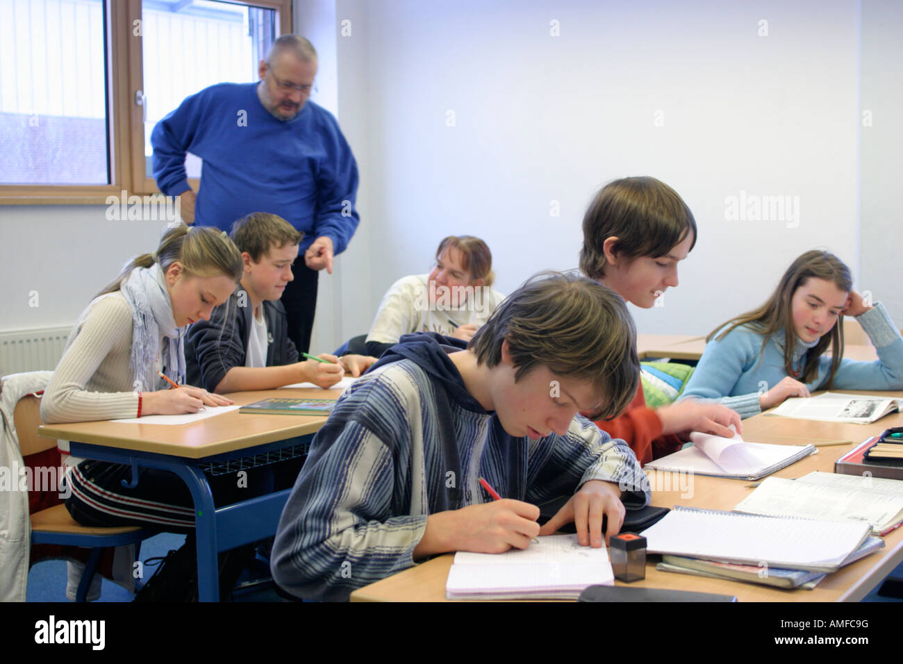 pupils and their teacher at class Stock Photo - Alamy