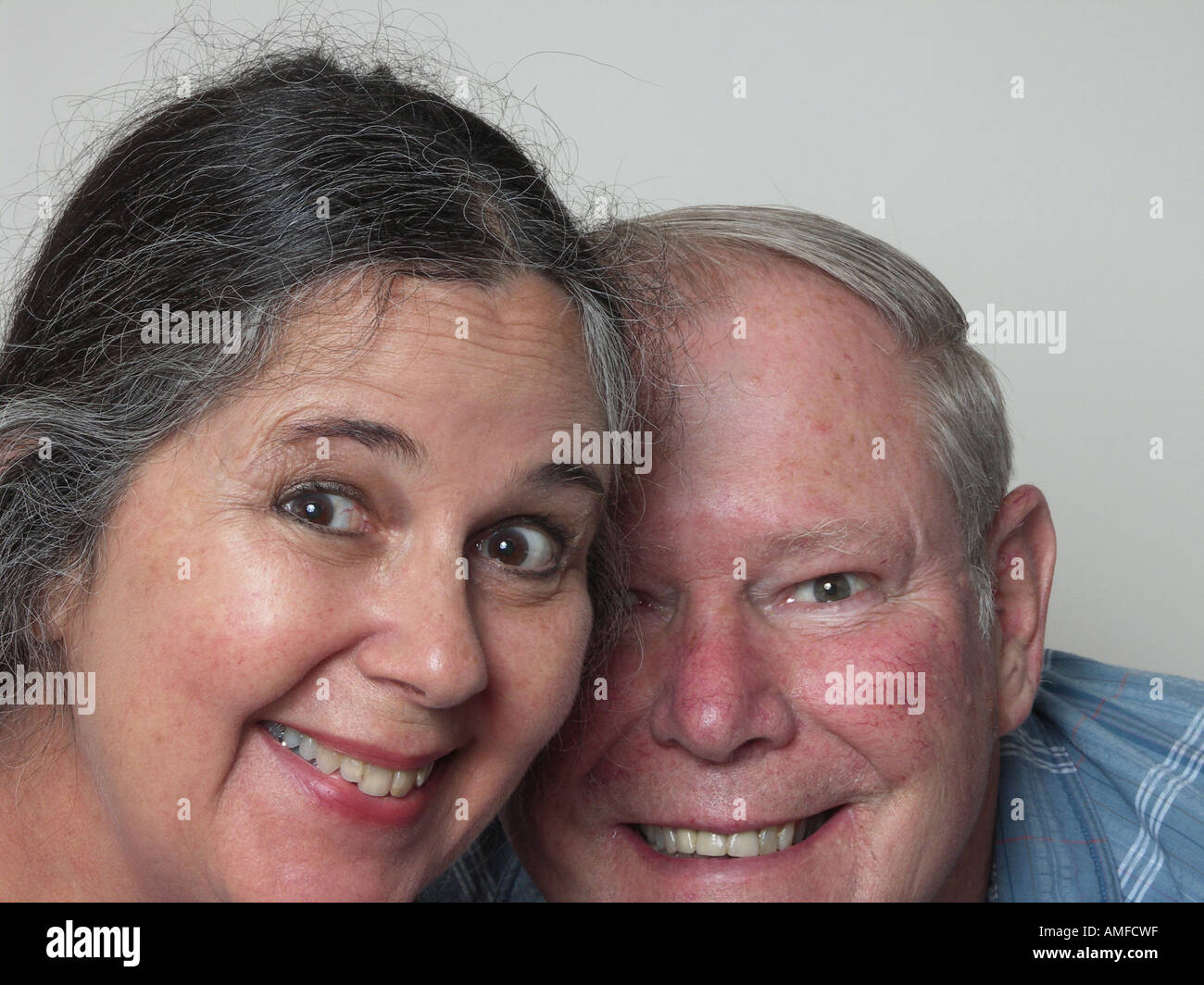Mature Couple sneaking a look Stock Photo - Alamy
