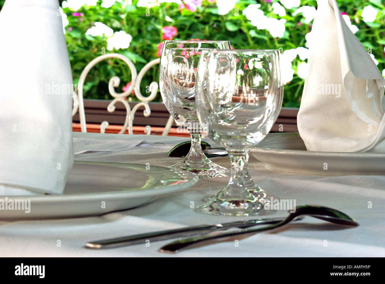 A classic and elegant dining table setting in a restaurant Stock Photo ...