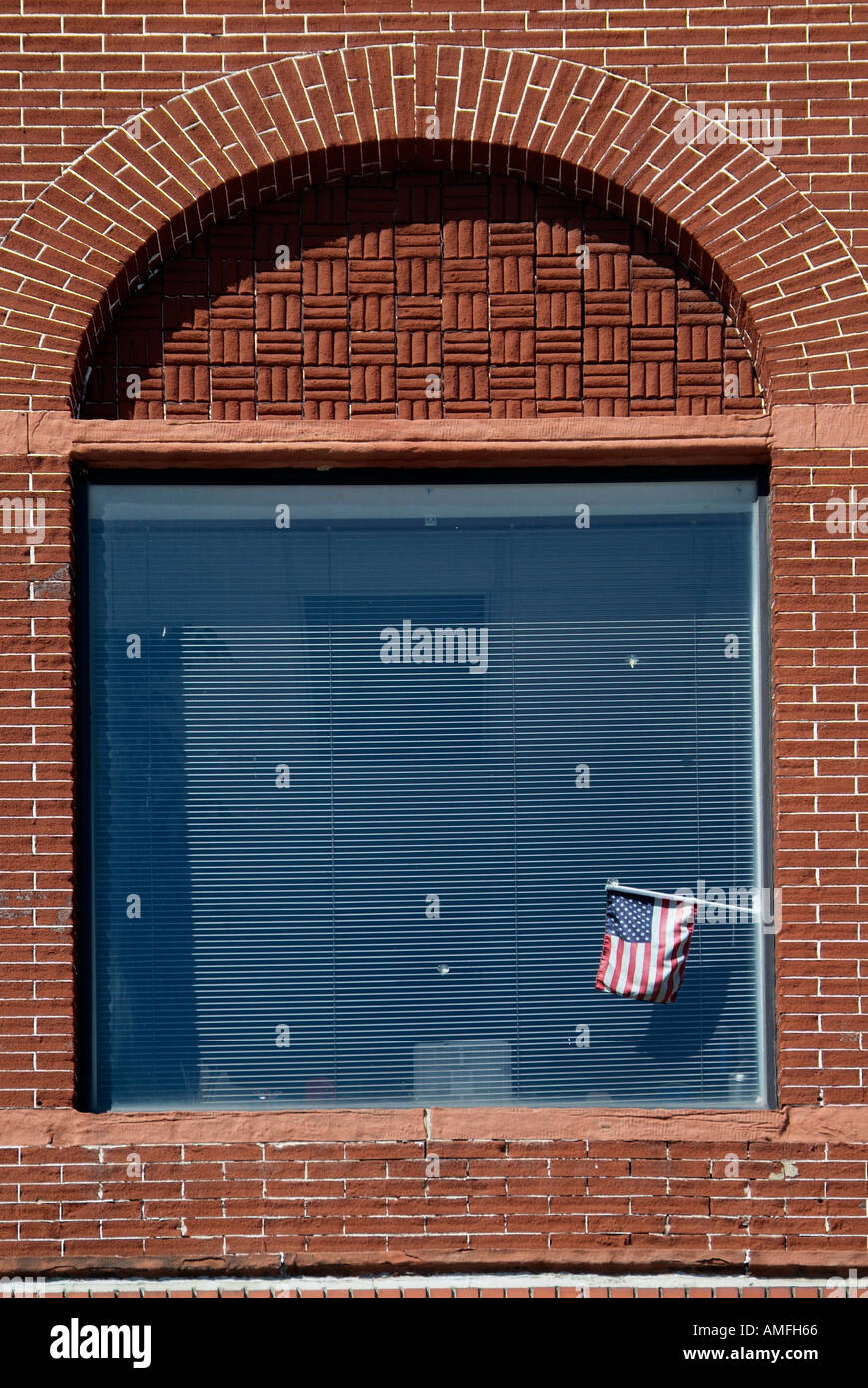 Small American flag in a window Stock Photo - Alamy