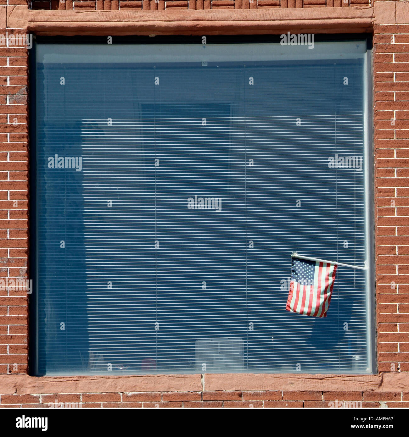 Small American flag in a window Stock Photo - Alamy