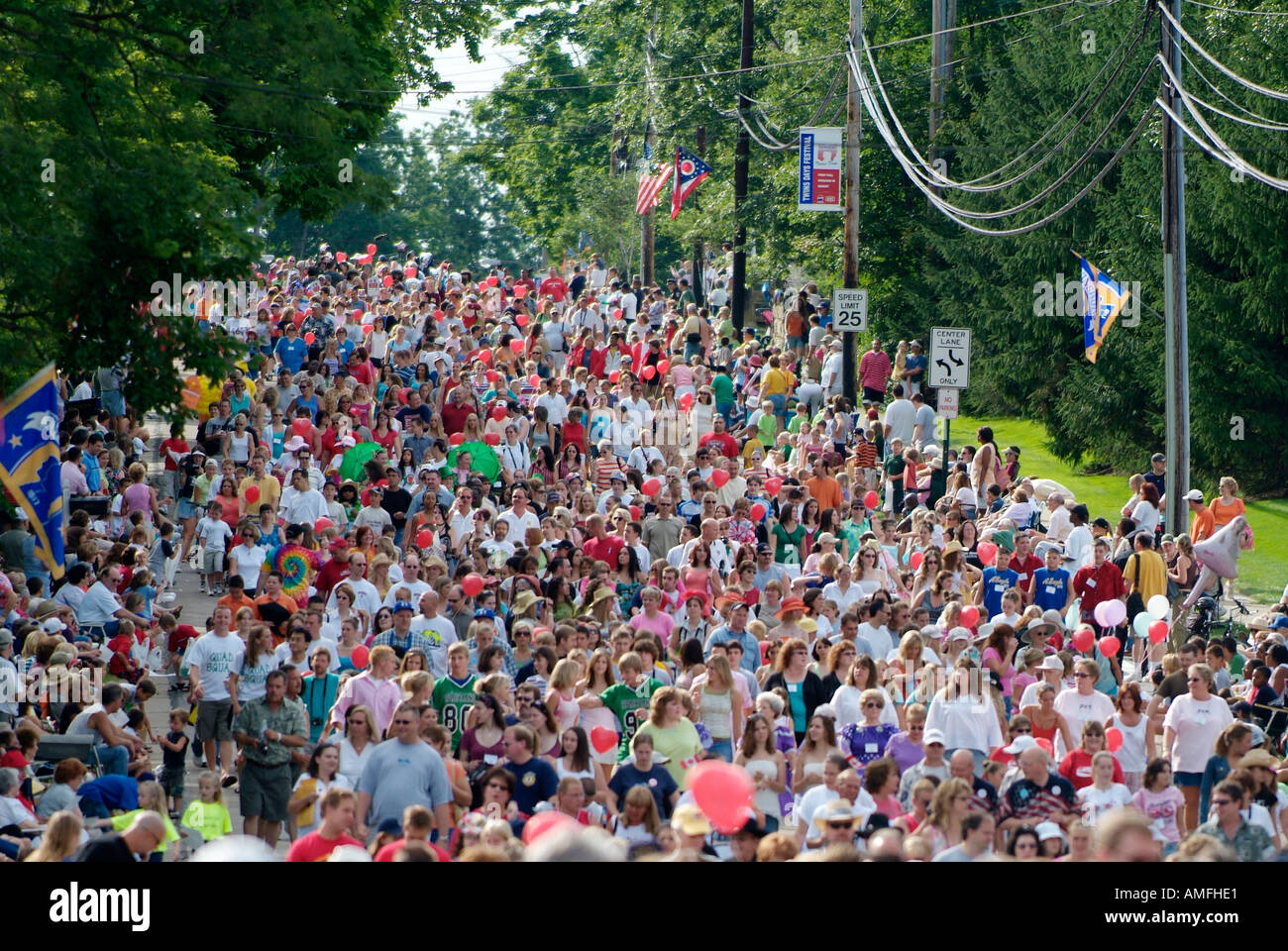 Crowds of people line the streets to view a parade in Twinsburg Ohio ...