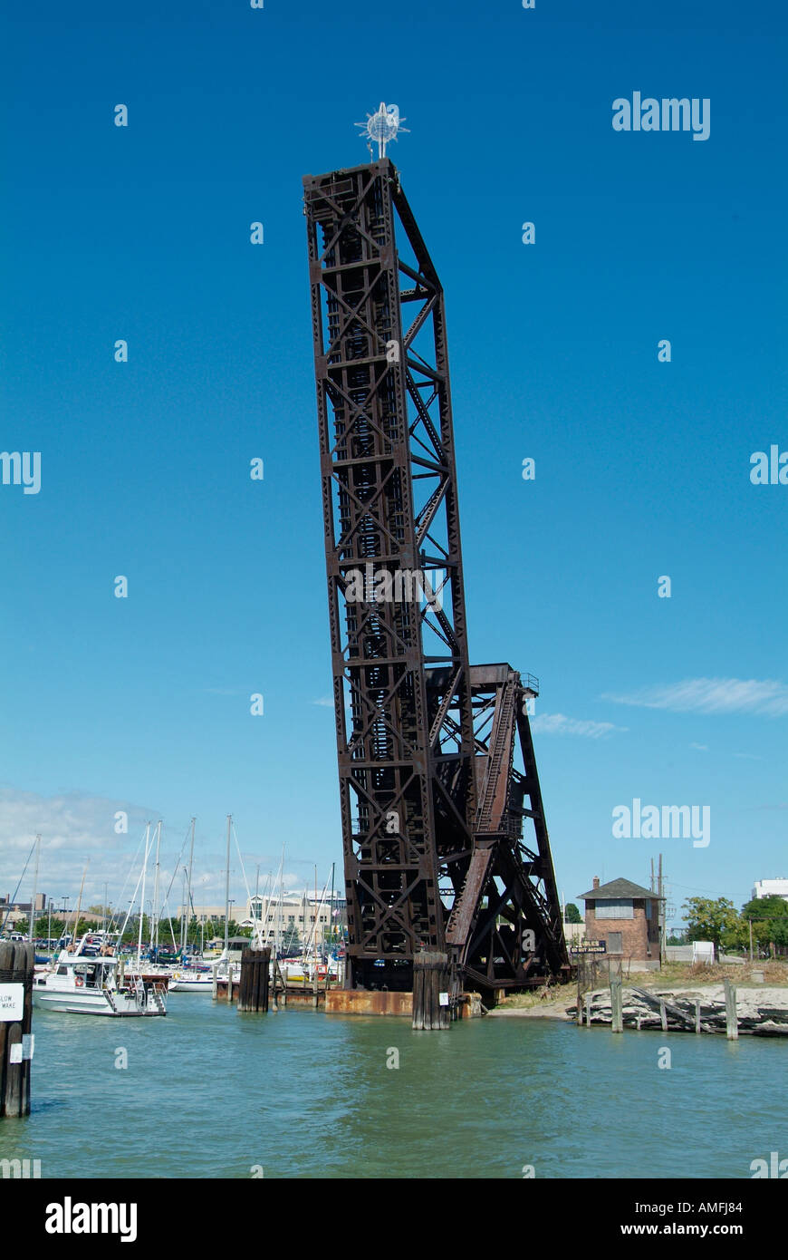A counter weight train bridge spans the Black River at Port Huron ...