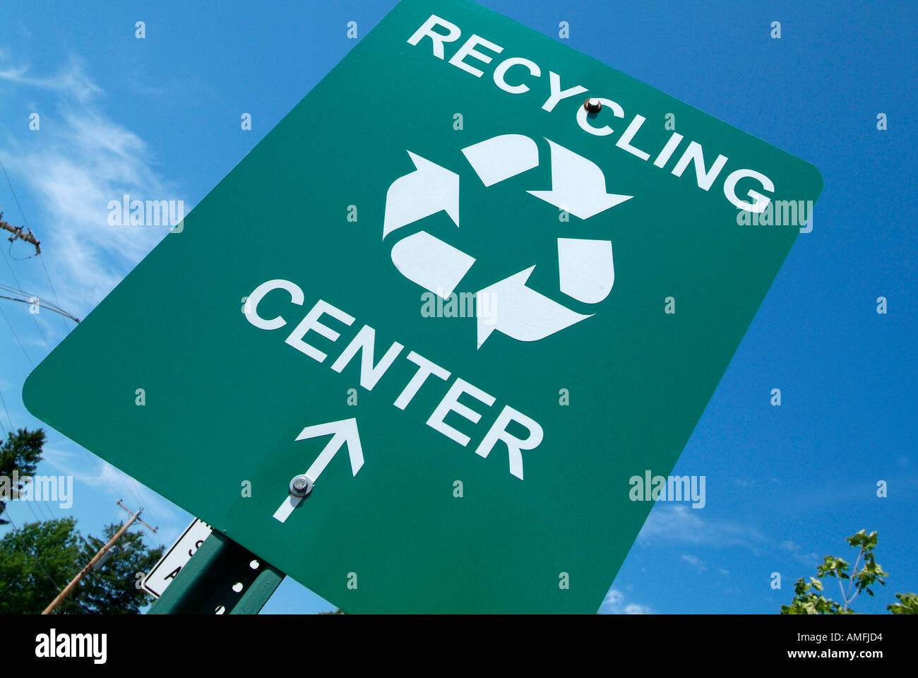 Highway sign showing the location and directions to a recycling center ...