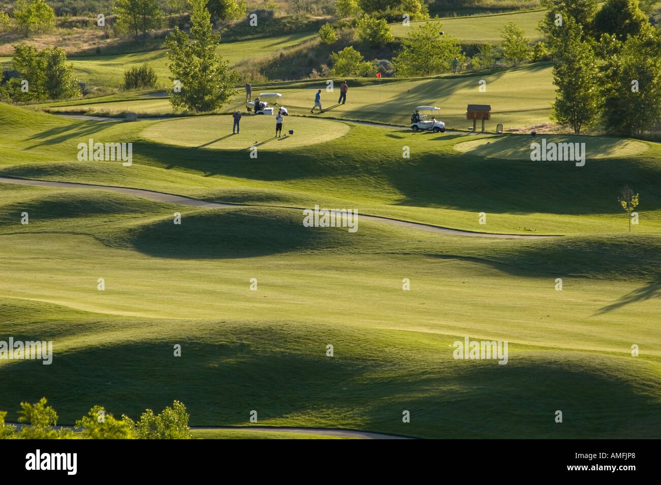 Golf course view sunset Stock Photo - Alamy
