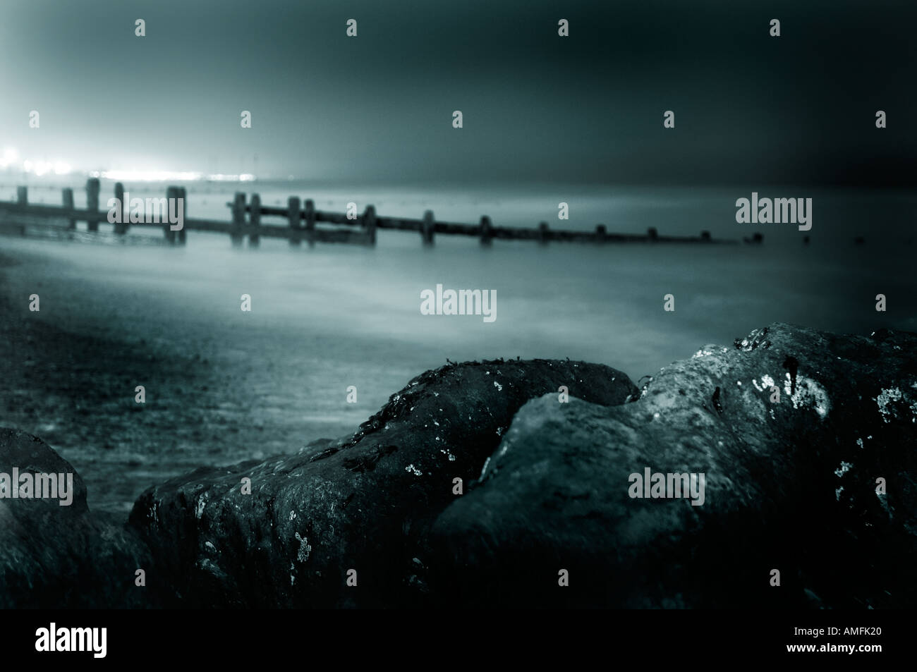 Spooky East Sussex UK beach scene by night Stock Photo - Alamy