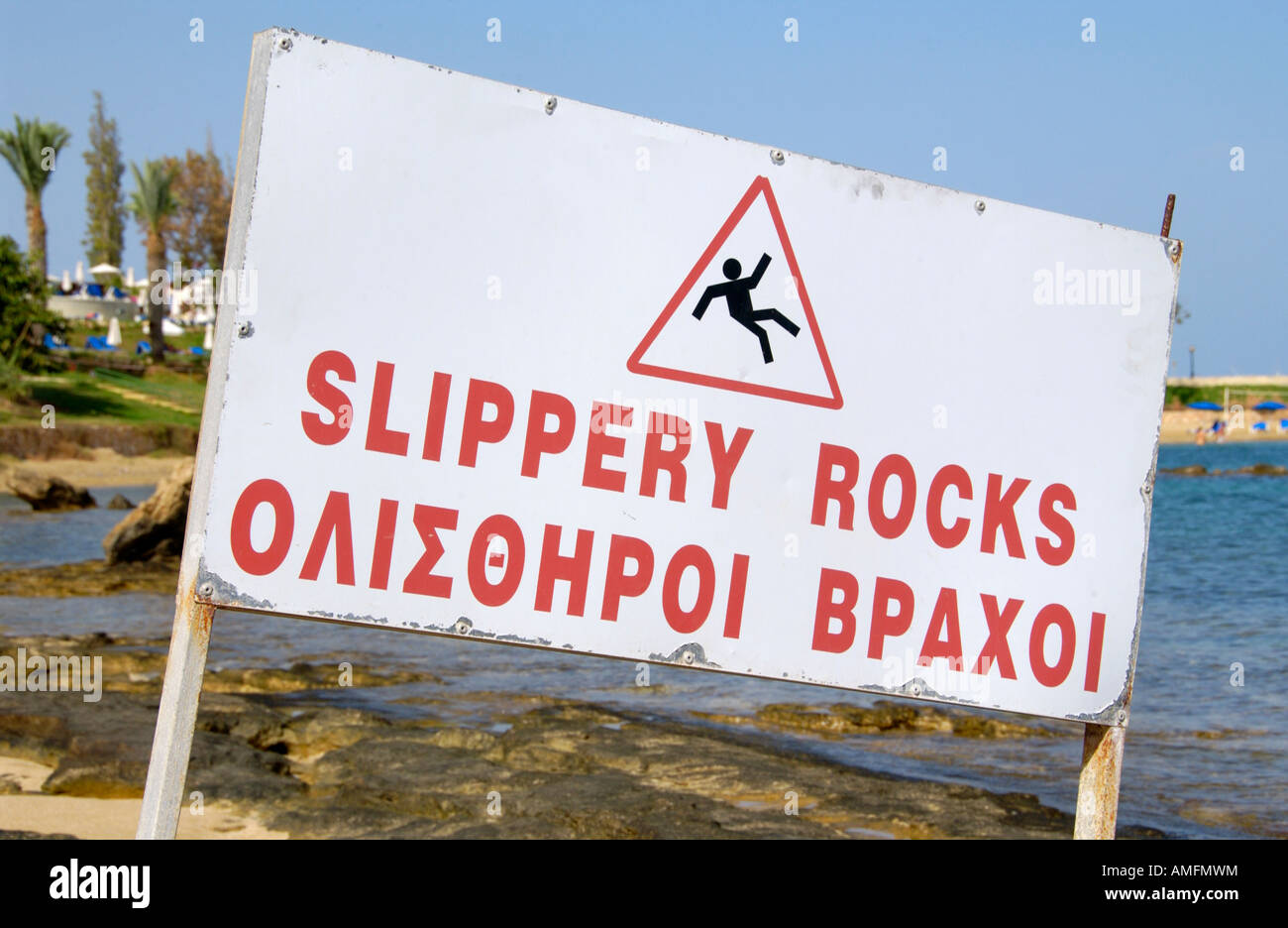 SLIPPERY ROCKS warning sign at Penera beach on the Mediterranean island ...