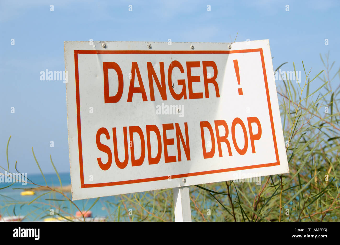 DANGER SUDDEN DROP sign at Fig Tree Bay Protaras on the Mediterranean ...