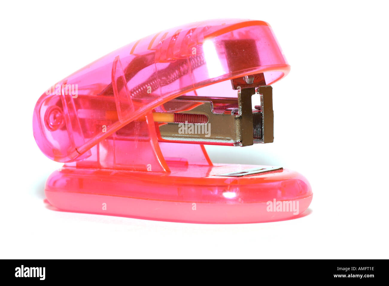 Pink stapler on white background Stock Photo - Alamy