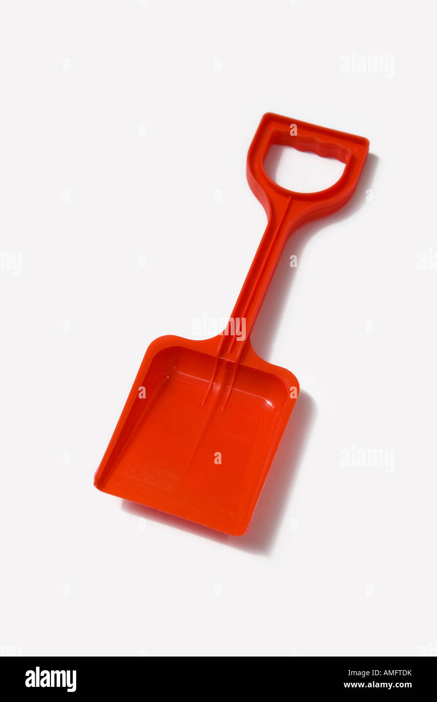 Red childrens spade on white background Stock Photo - Alamy