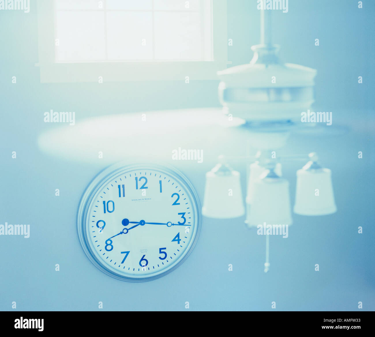 Home interior clock and fan Stock Photo - Alamy