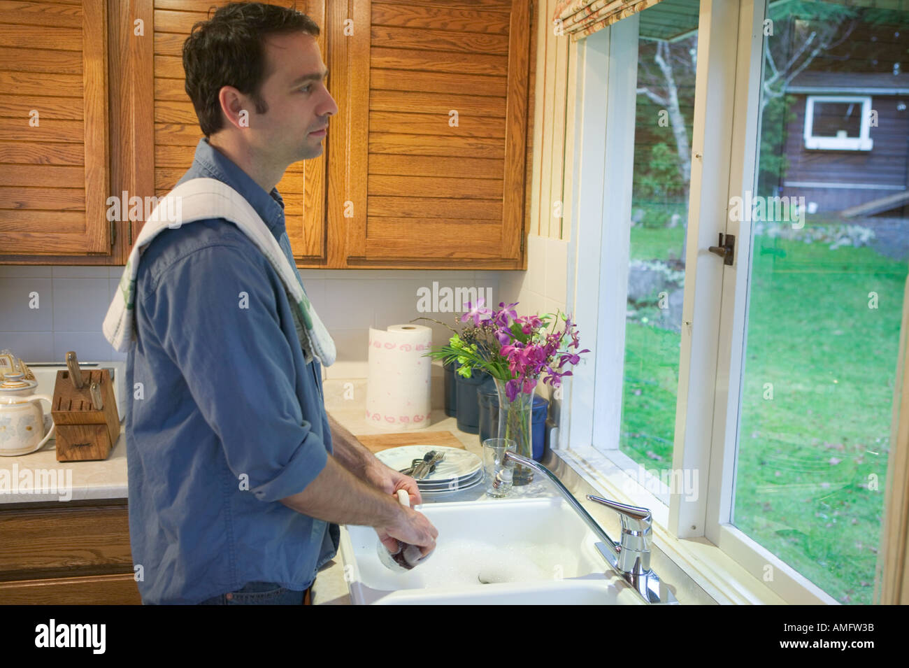 Man washing dishes Stock Photo - Alamy
