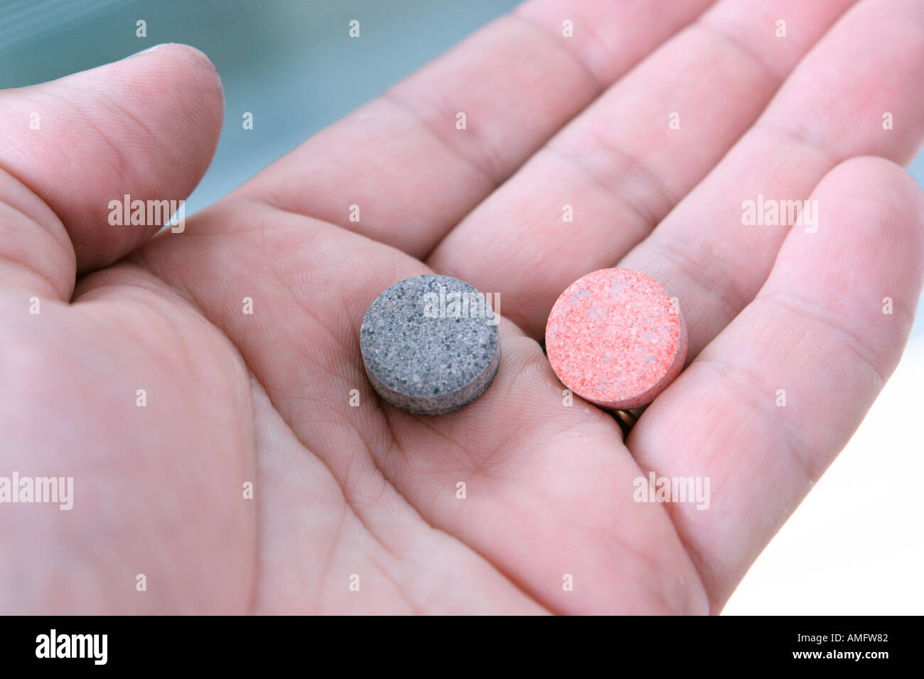antacid tablets in hand Stock Photo - Alamy