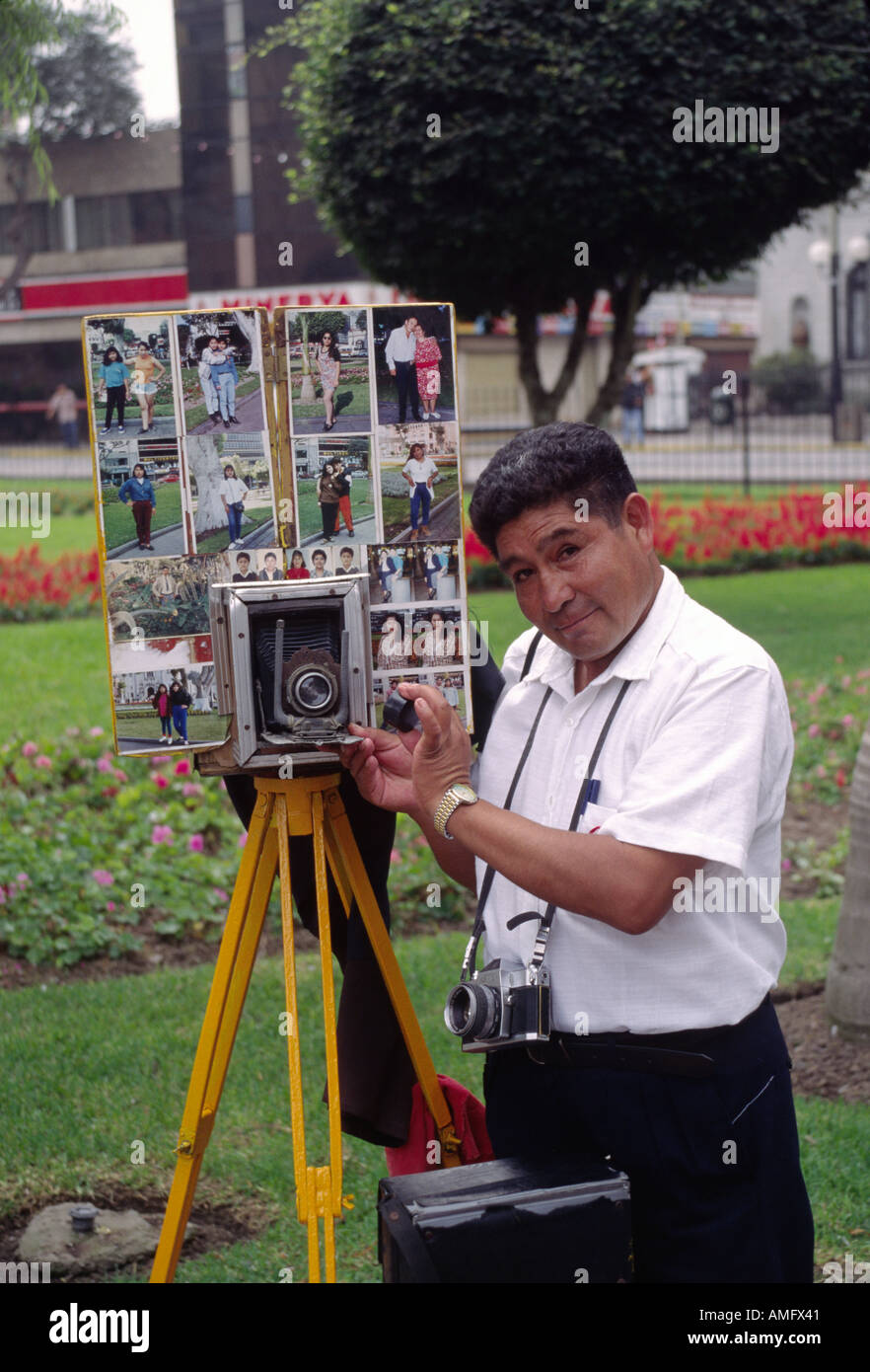 PHOTOGRAPHER with old time camera with photos in the MAIN SQUARE of ...
